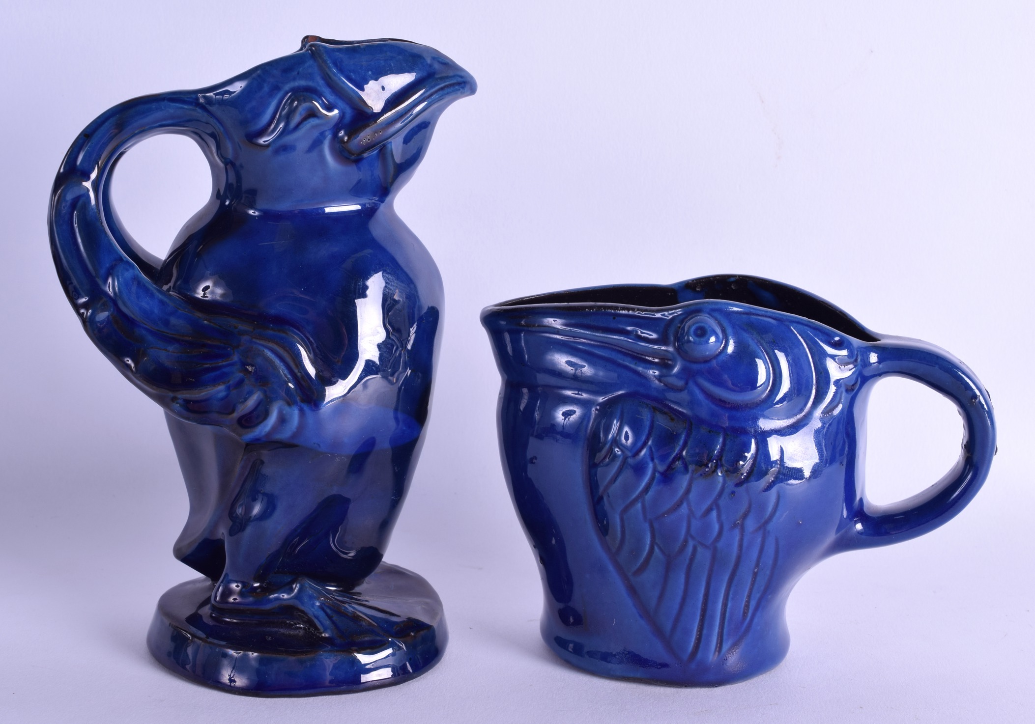 A C H BRANNAM POTTERY BIRD JUG together with a smaller bird jug. 16 cm ...