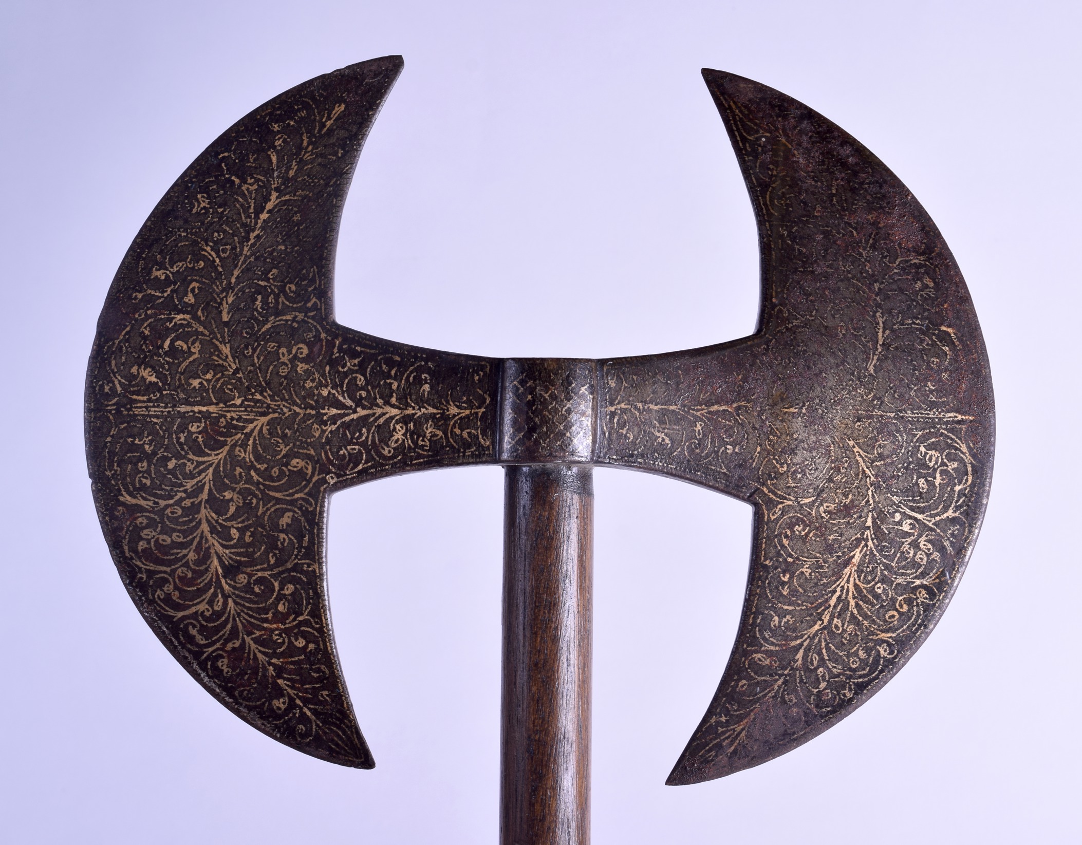 AN UNUSUAL GOLD INLAID IRON AXE upon an associated cylindrical handle ...
