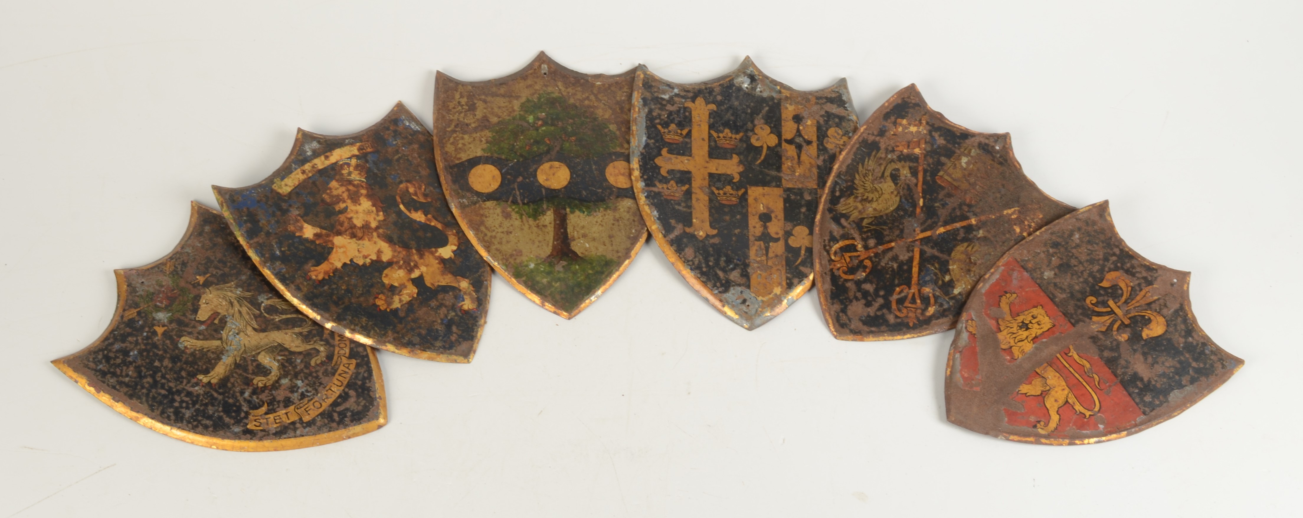 Six painted metal armorial shields with gilt border decoration, 22.5 x ...