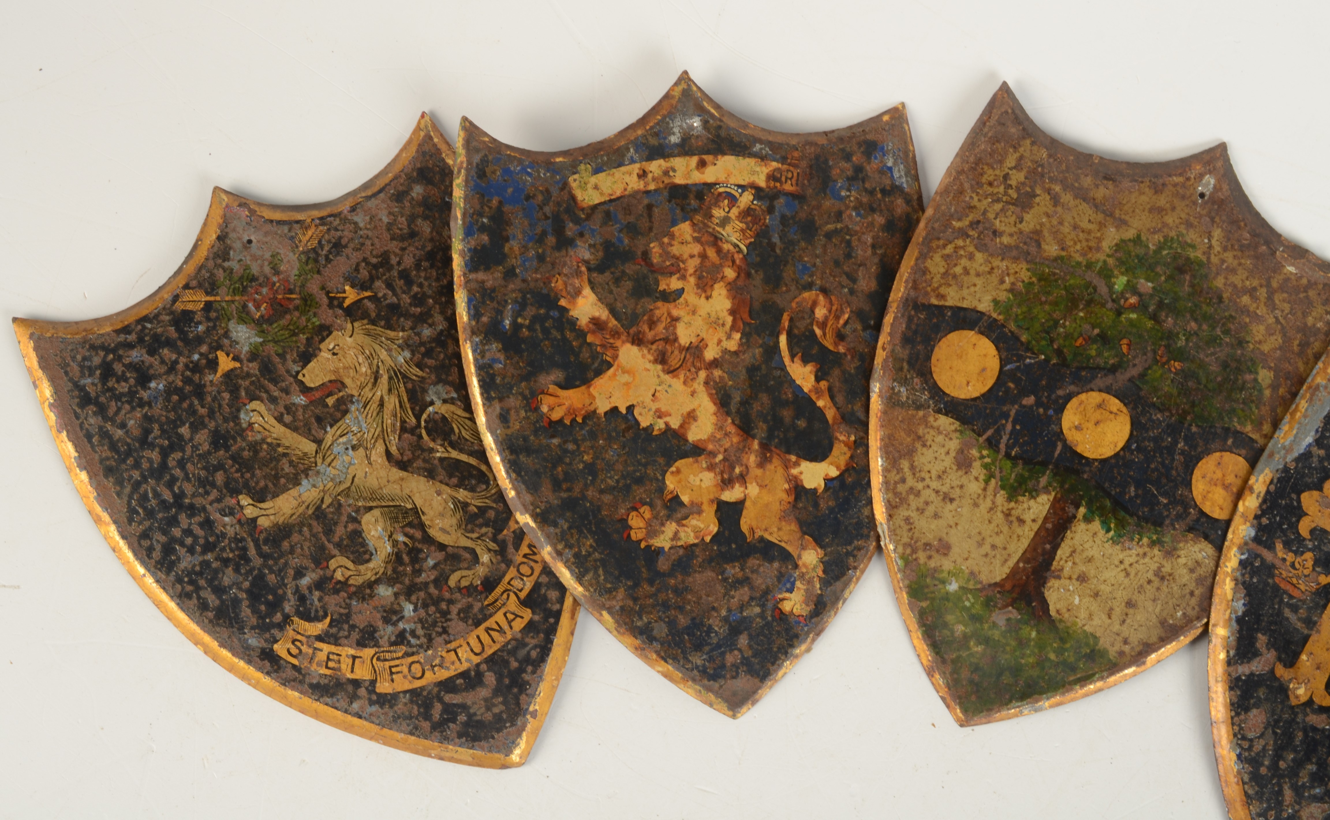 Six painted metal armorial shields with gilt border decoration, 22.5 x ...
