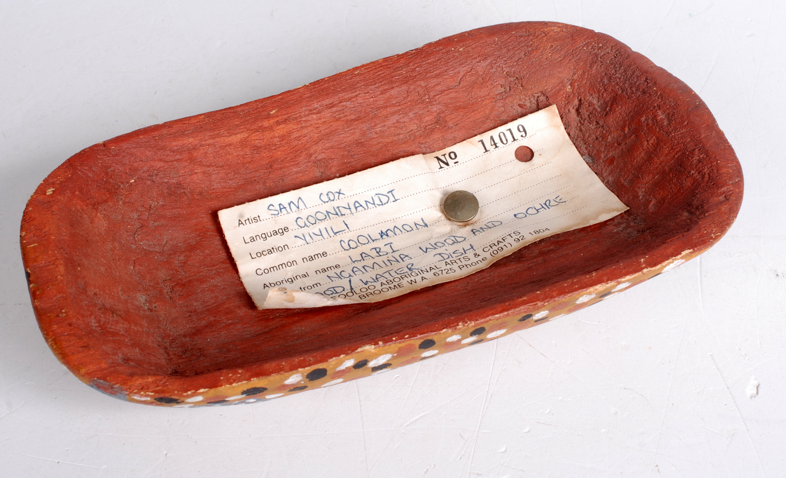 An Aboriginal Yiyili Ngamina wood and ochre food dish by Sam Cox, 21 x ...