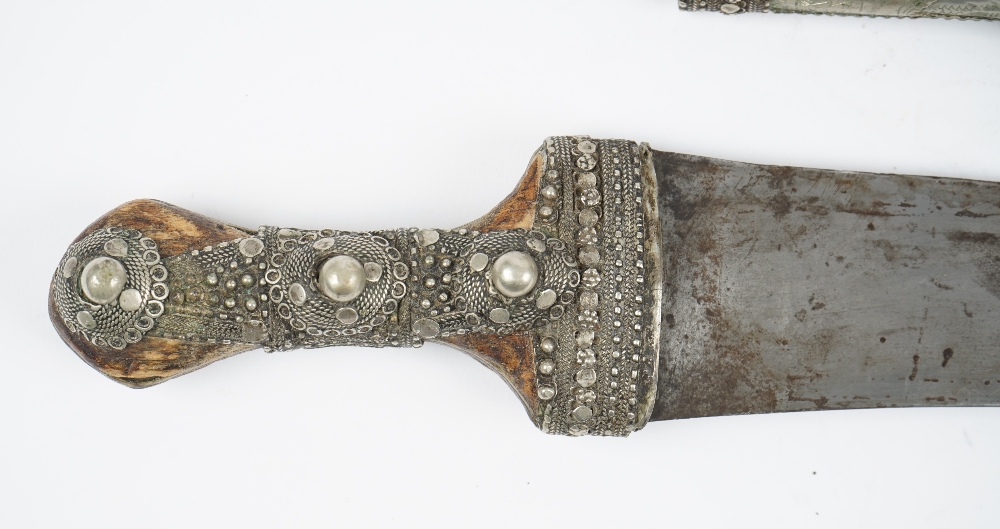 A Saudi Arabian long knife, 19th century, with curved steel blade, 40cm ...