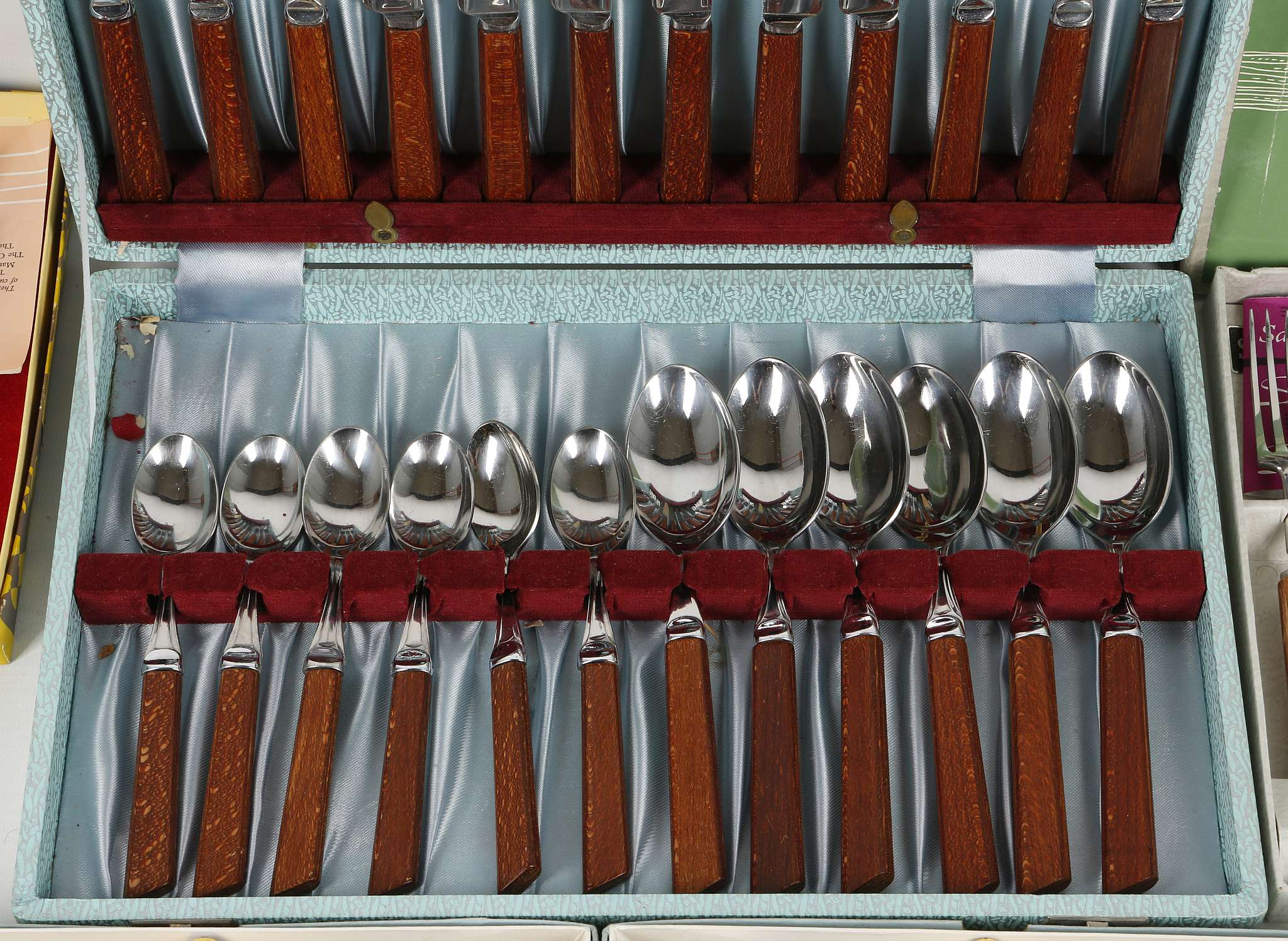 A collection of 1950/60's wooden handle designer cutlery in original ...