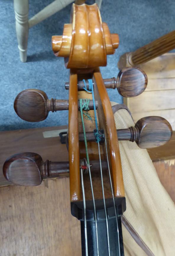 A Romanian cello in fabric case and an early 20th century carved and ...
