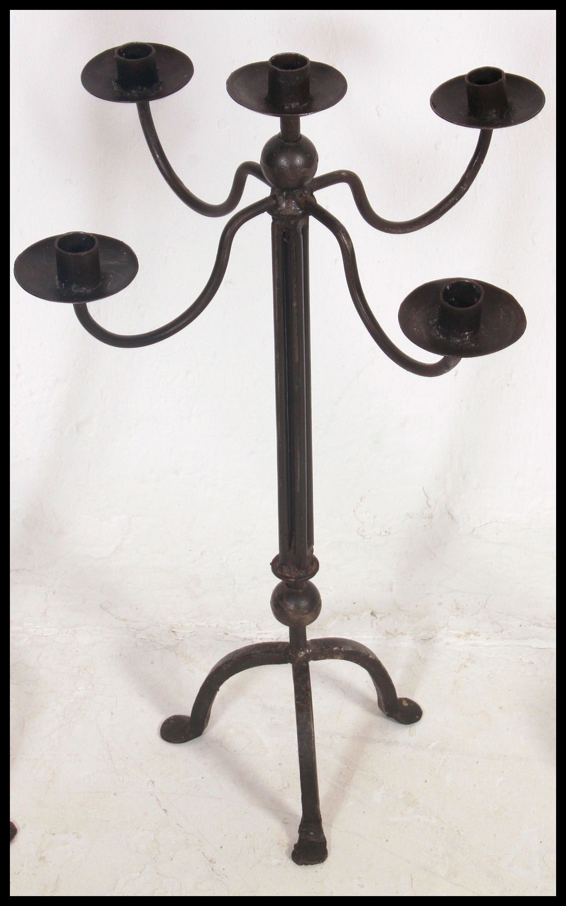 A set of 3 large medieval style cast iron candelabra candlesticks ...
