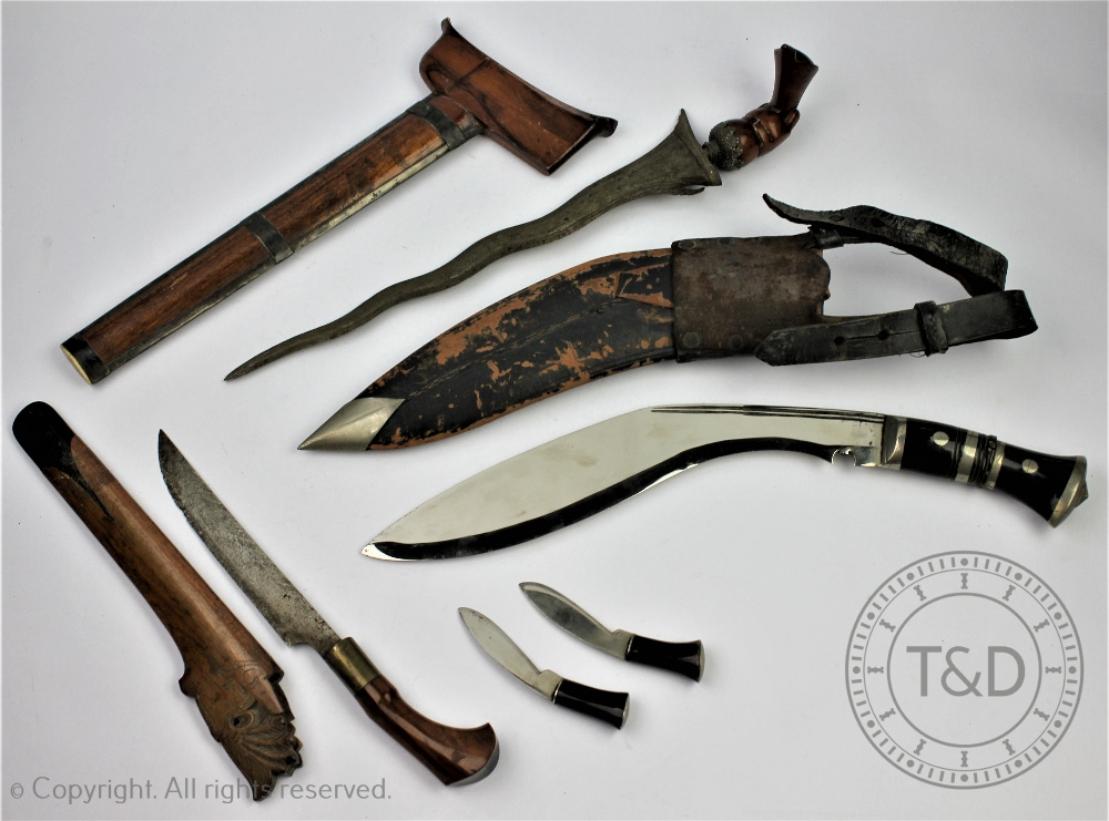A Kukri knife with karda and chakmak within sheath with a Kriss knife ...