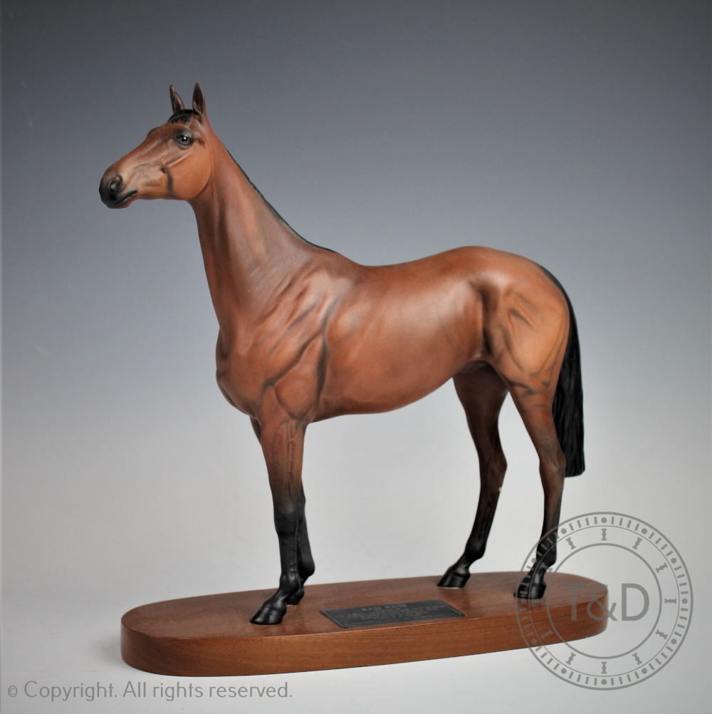 A Beswick Conisseur series model of Red Rum, designed standing on a ...