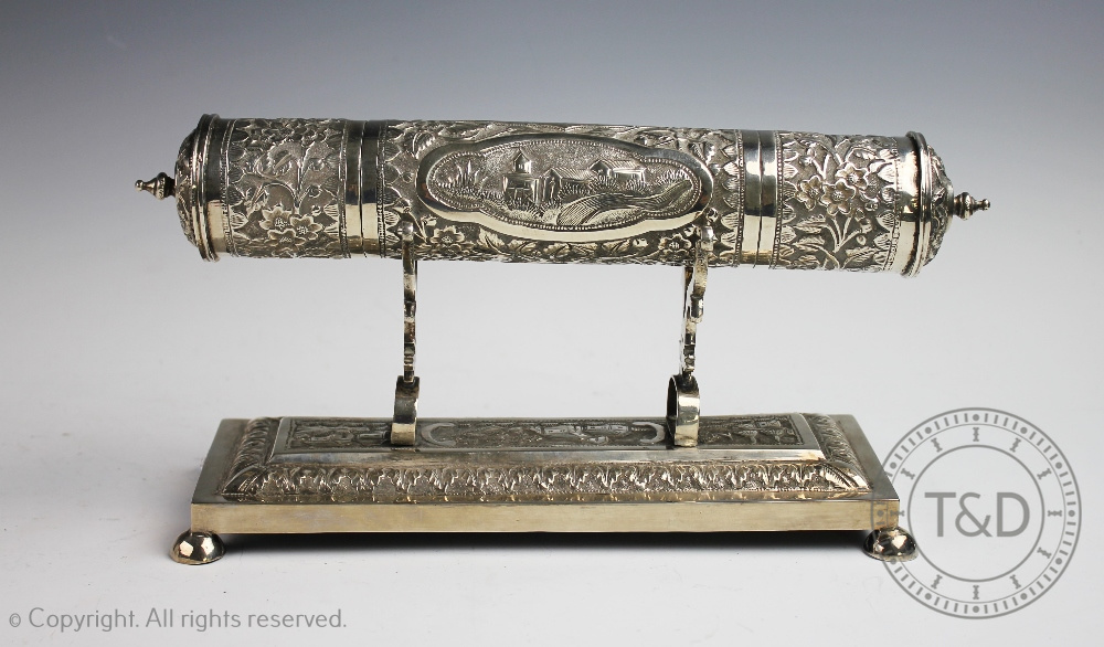 An Indian silver presentation scroll case and stand, the cylindrical case decorated with reserves