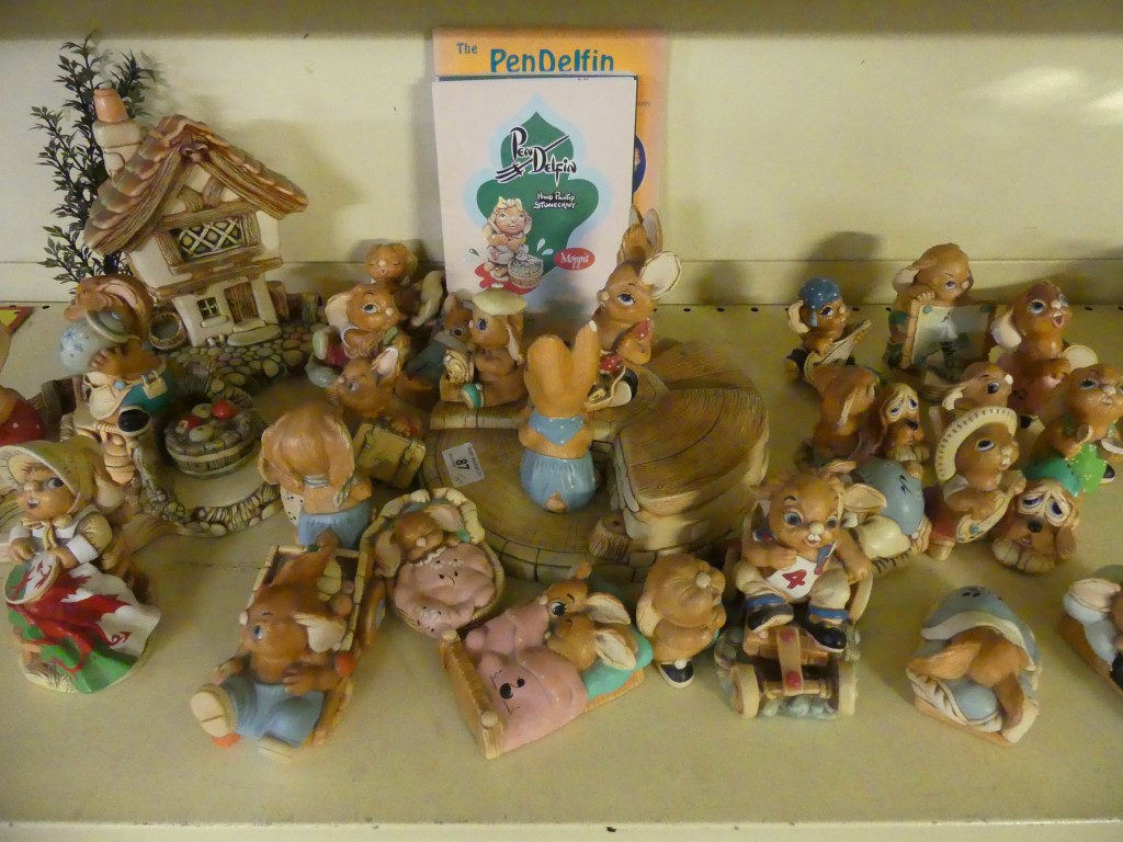 A collection of Pendelfin model rabbit, together with three stands and ...
