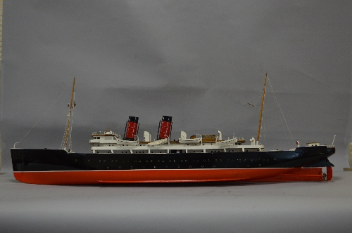 A POWERED MODEL OF A TWO FUNNEL OCEAN LINER, red and black livery ...