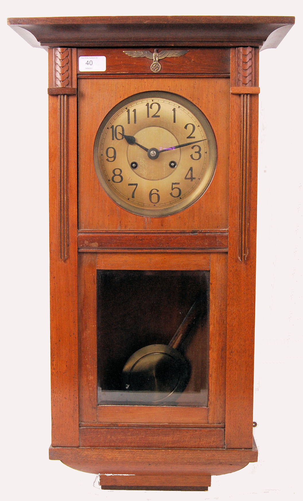 A large 20th century German made wooden wall clock with brass Nazi ...