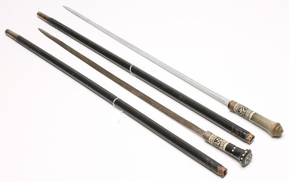 AN INDIAN SWORD STICK, with 25 1/2" fullered blade, twist release ...