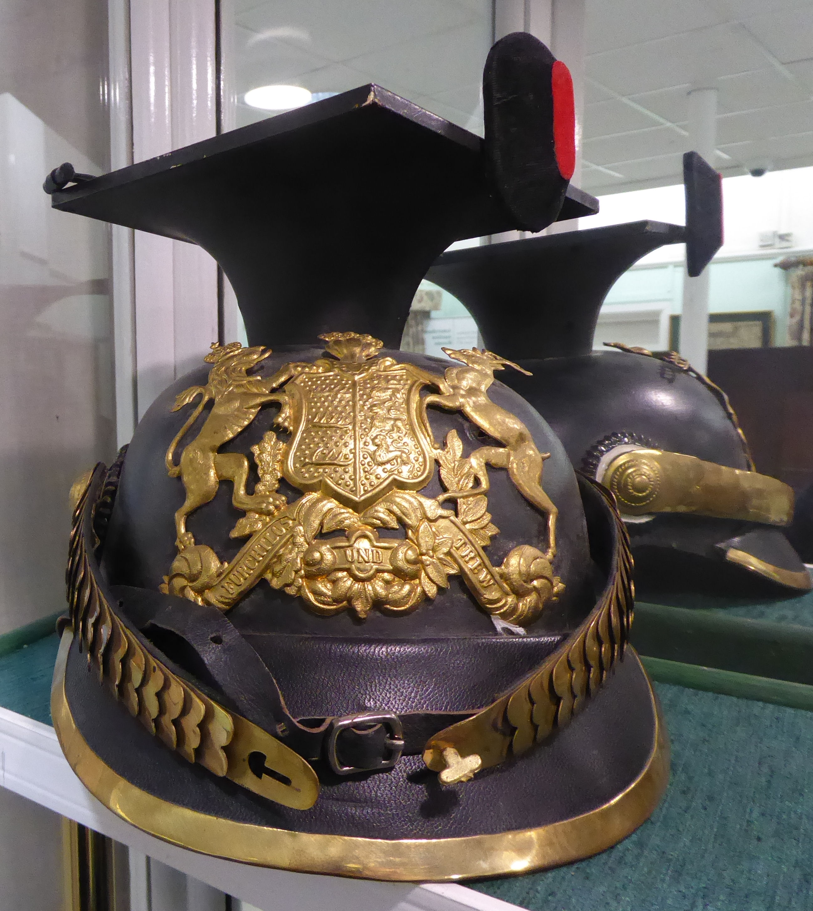 A reproduction of a German Uhlans lancer cap with a mortar board top ...