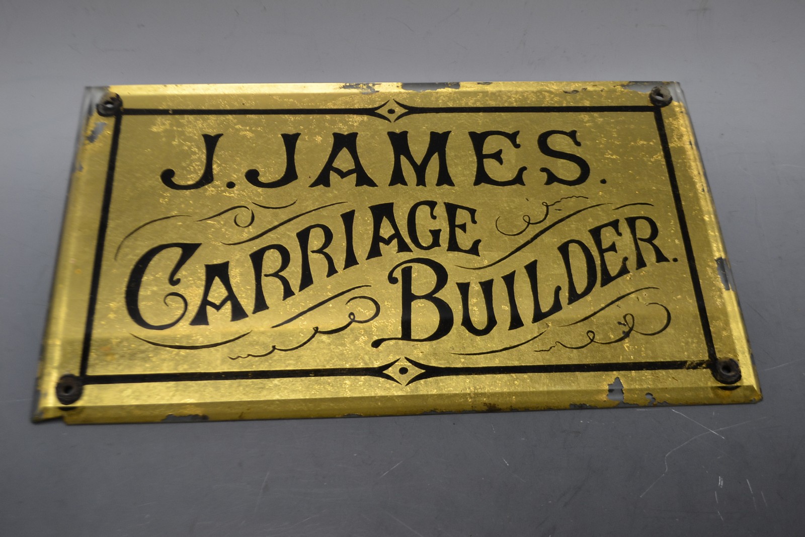 An interesting Victorian shop sign, J. James, Carriage Builder, 31cm wide