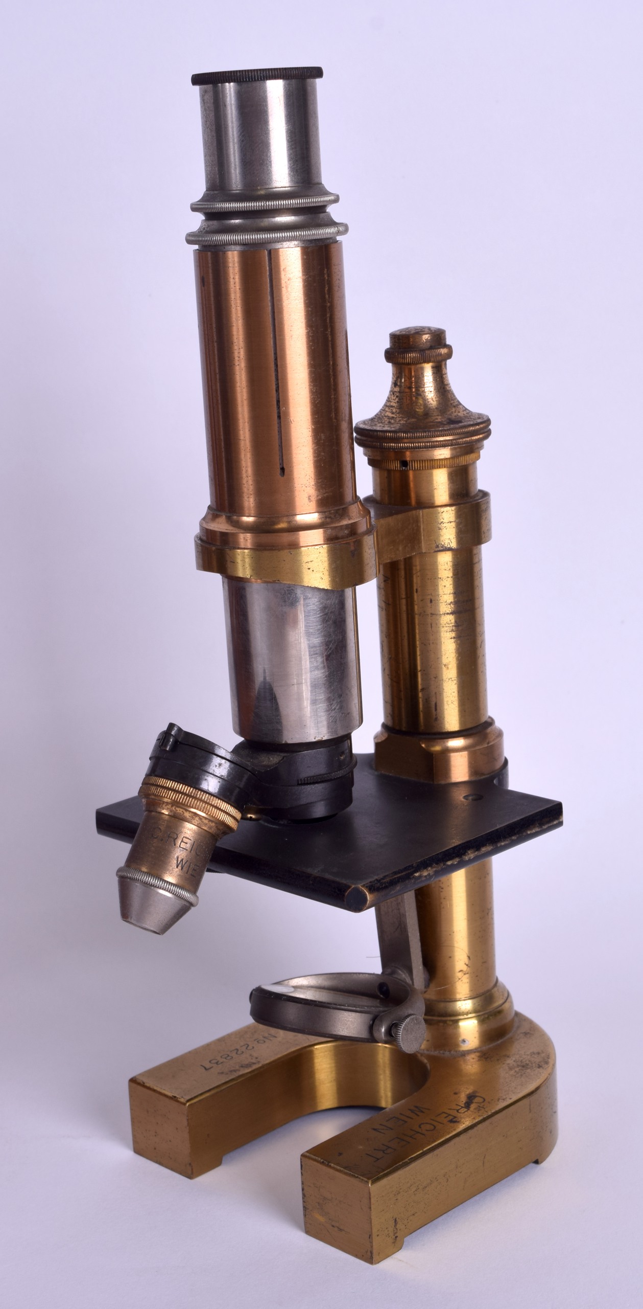 AN ANTIQUE MICROSCOPE by C Reichert Wien, No 22837. 26 cm high.