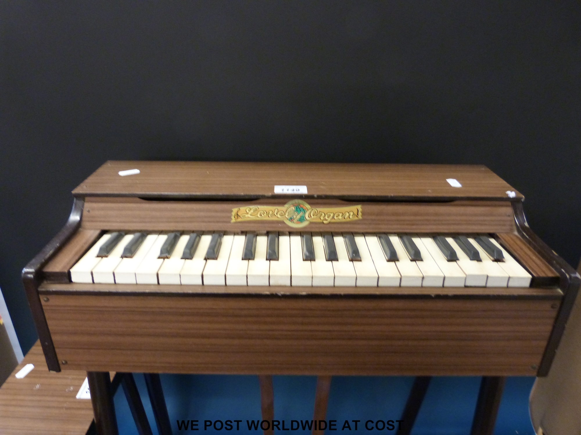 A miniature child's bellows-operated organ complete with stool by ...